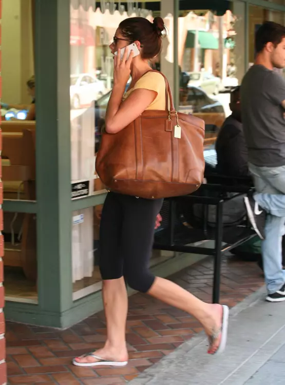 Ashley Greene hat in Coach Bleecker Legacy Weekend Tote (2)